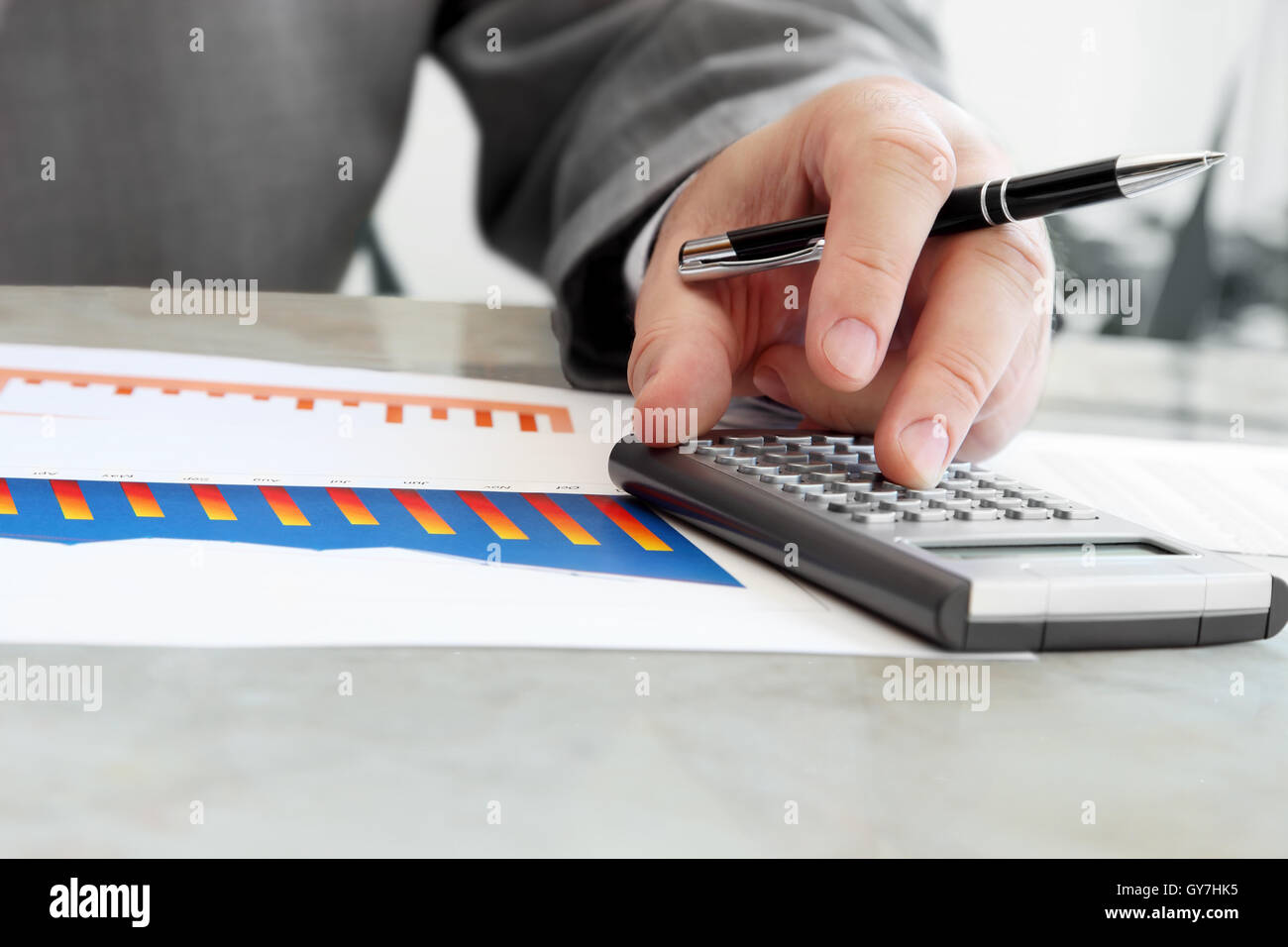 Businessman with Calculator Stock Photo - Alamy