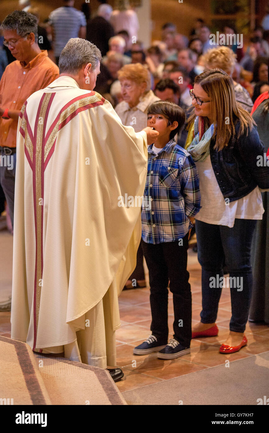 Children take communion after mass at a Laguna Niguel, CA, Catholic ...