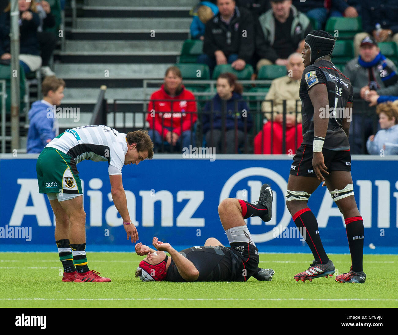 LONDON, ENGLAND - SEPTEMBER 17: Lee Dickson of Northampton checking on ...