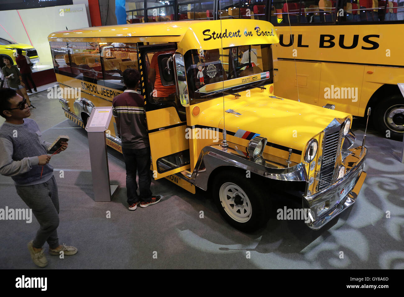 Pasay City, Philippines. 18th Sep, 2016. Visitors look at a school bus ...