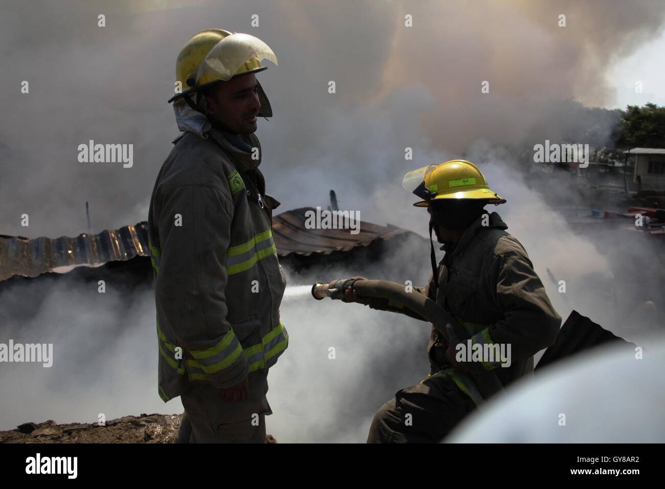 Kabul, Afghanistan. 18th Sep, 2016. Firefighters try to extinguish a ...
