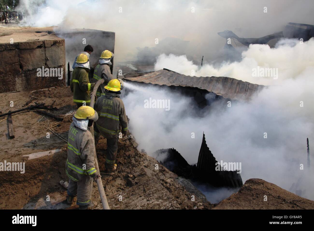 Kabul, Afghanistan. 18th Sep, 2016. Firefighters try to extinguish a ...