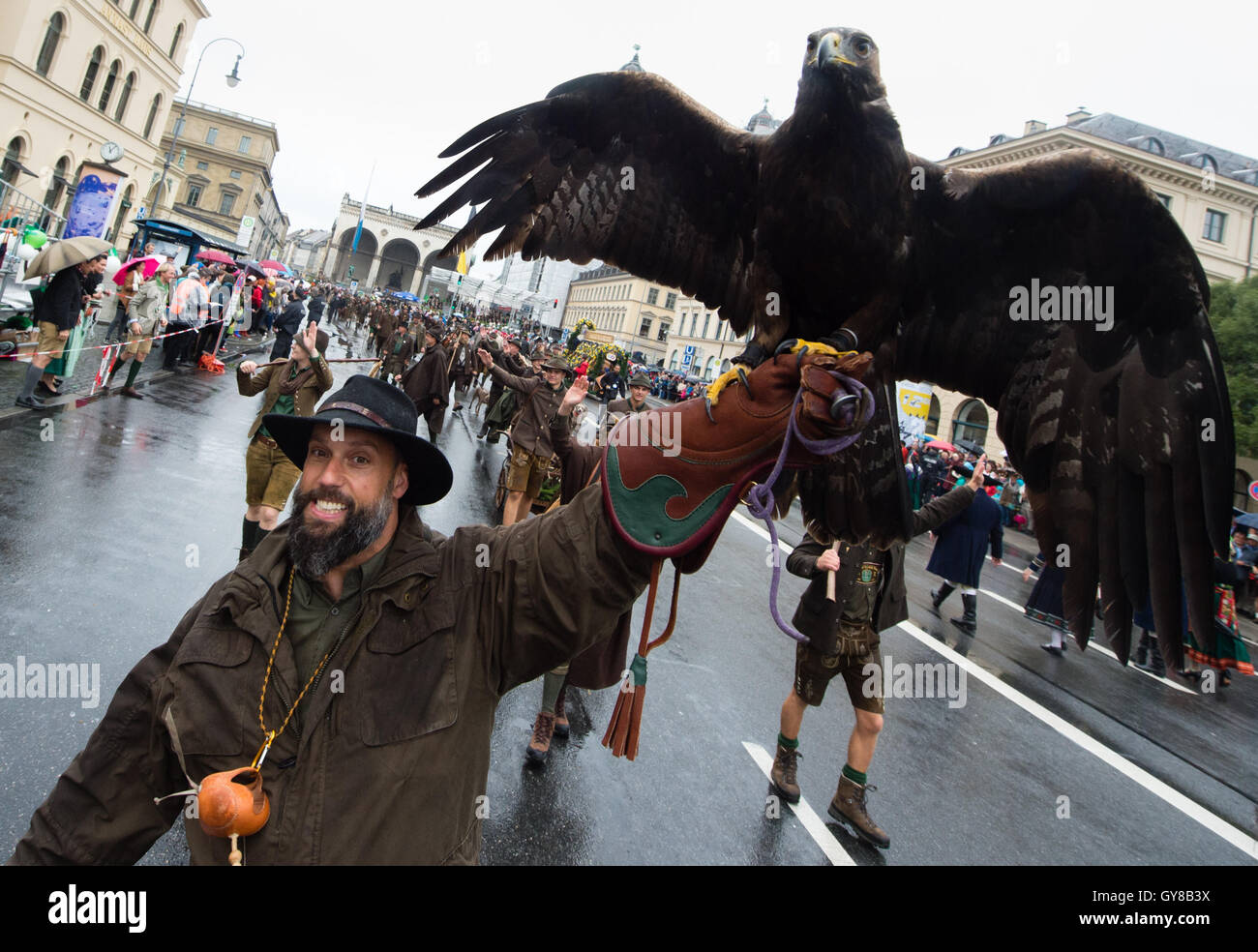 Munich, Germany. 18th Sep, 2016. An eagle and his handler take part in ...