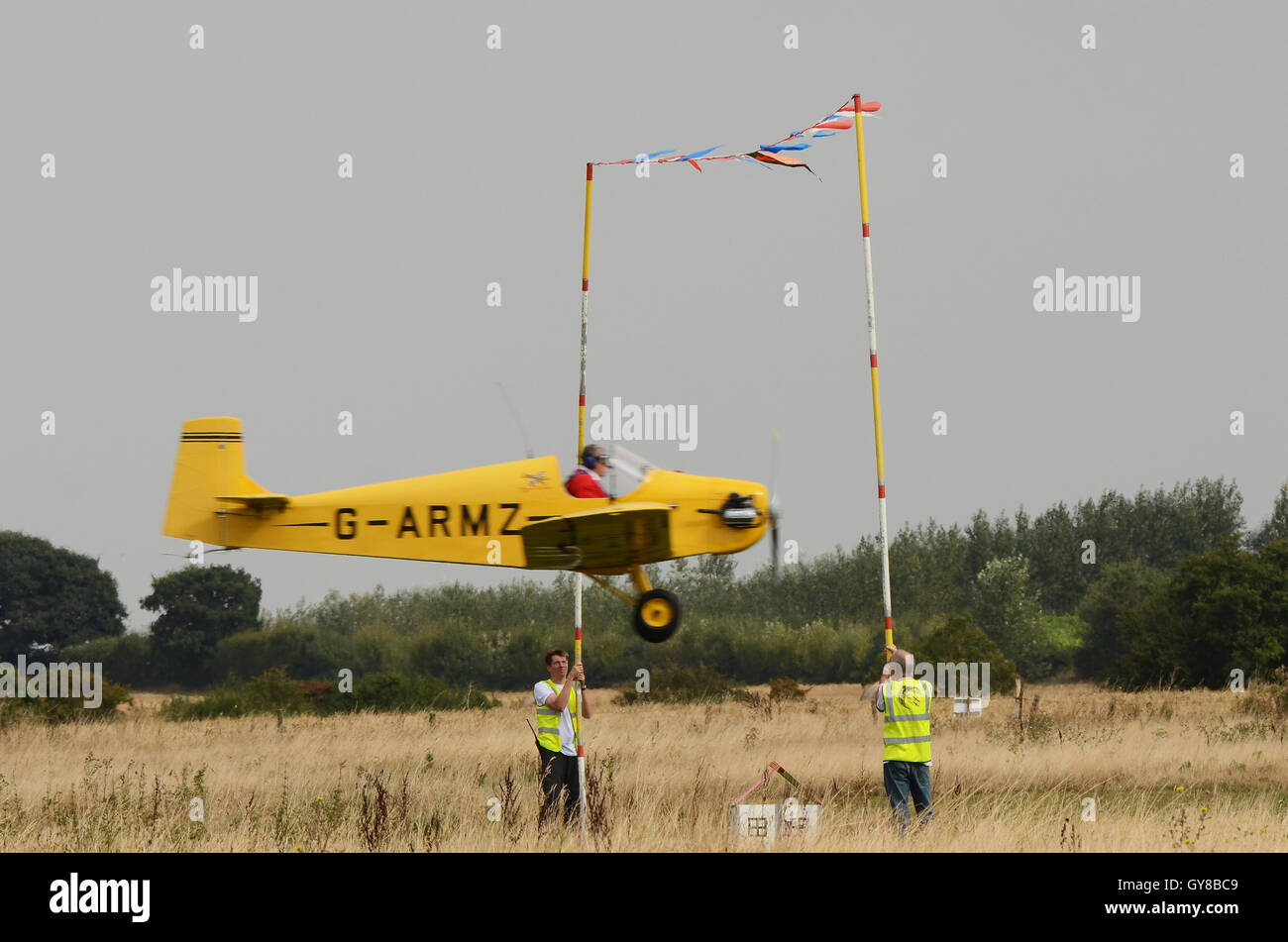 Turbulent Team Druine Turbulent plane limbo air display, flying under ...