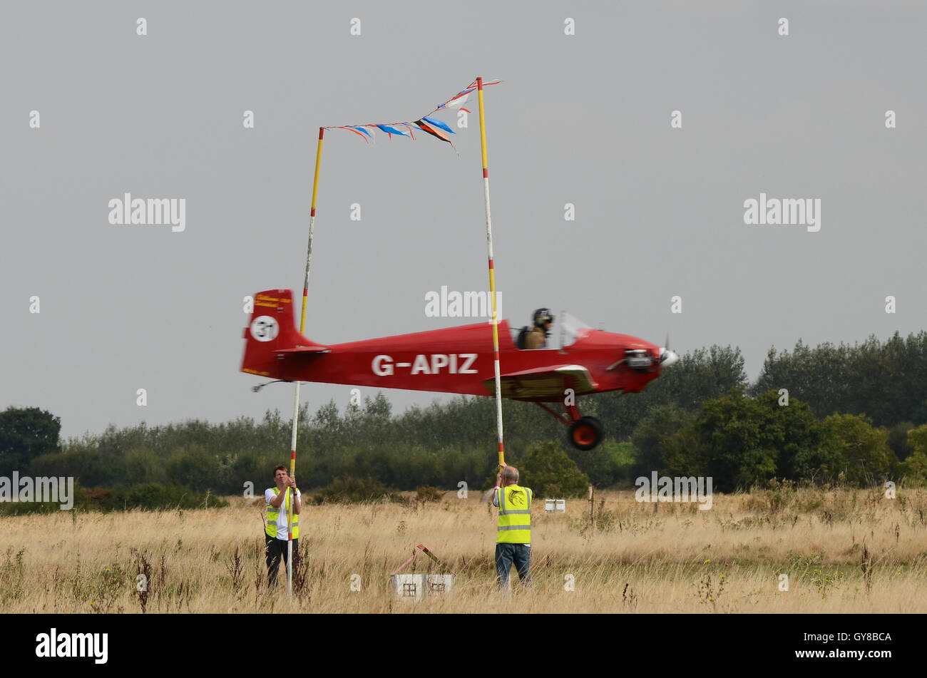 Turbulent Team Druine Turbulent plane limbo air display, flying under ...