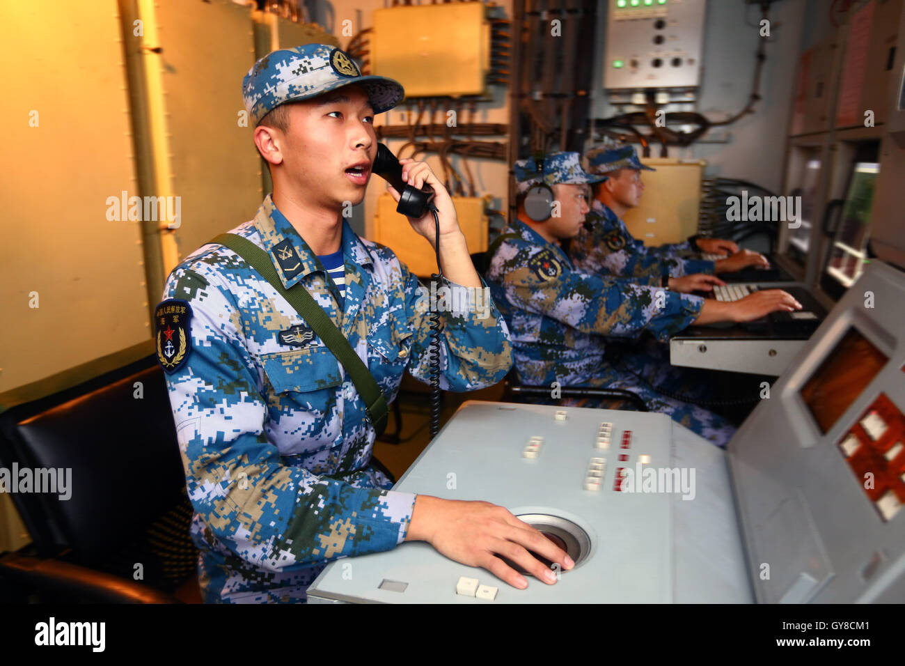 Aboard Warship Guangzhou. 18th Sep, 2016. A radar operator reports ...