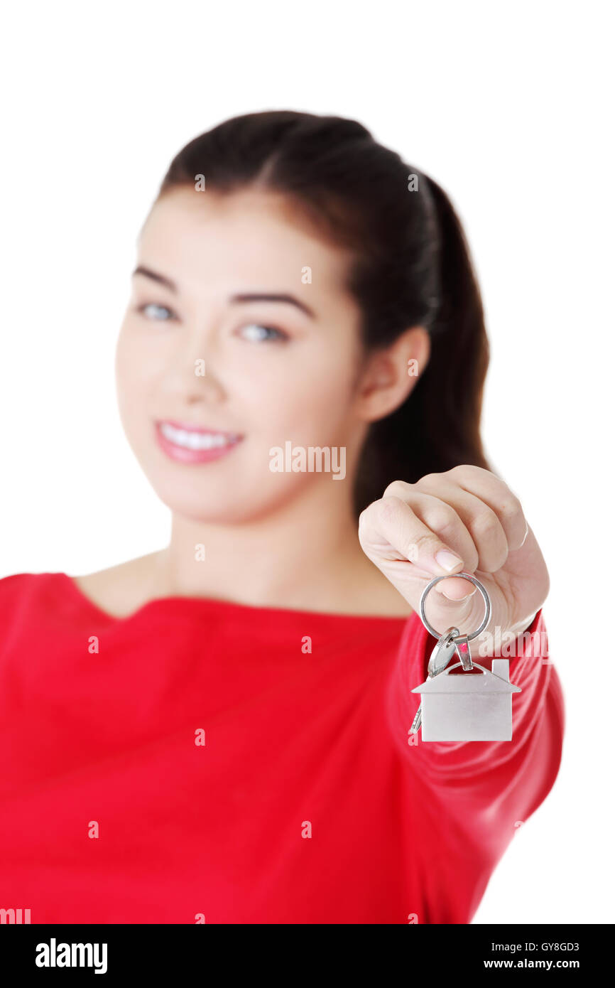 Happy casual woman holding home keys Stock Photo - Alamy