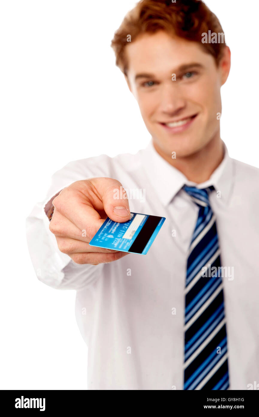 Corporate man offering you credit card Stock Photo - Alamy