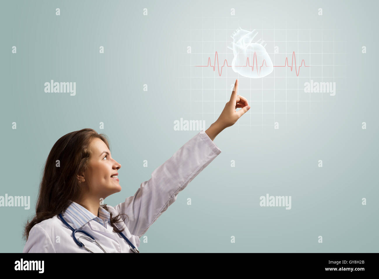 young woman doctor finger glowing heart symbol Stock Photo - Alamy