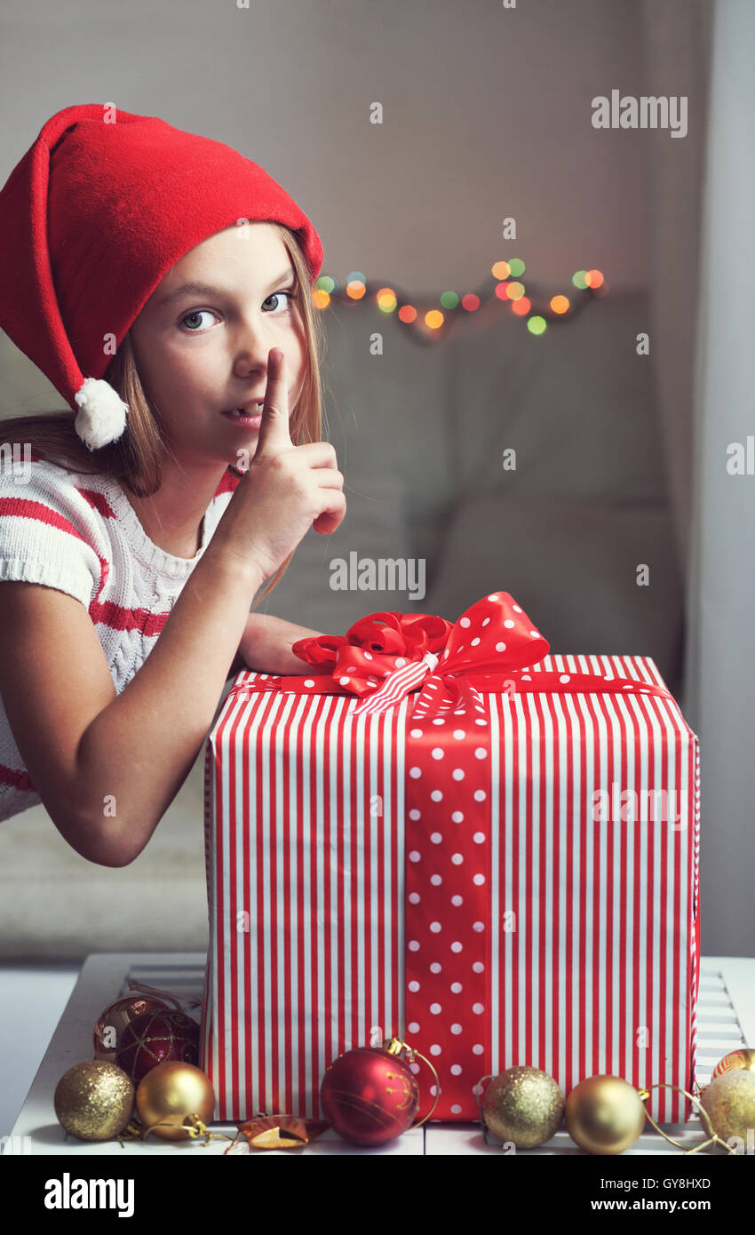 Child holding big gift Stock Photo - Alamy