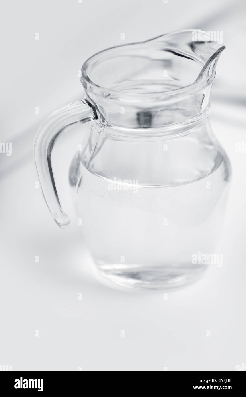 Glass can with water Stock Photo - Alamy