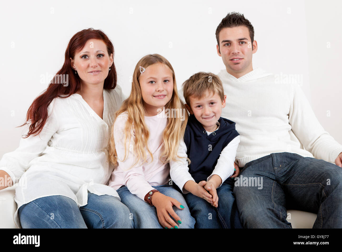 Happy family with their children Stock Photo - Alamy