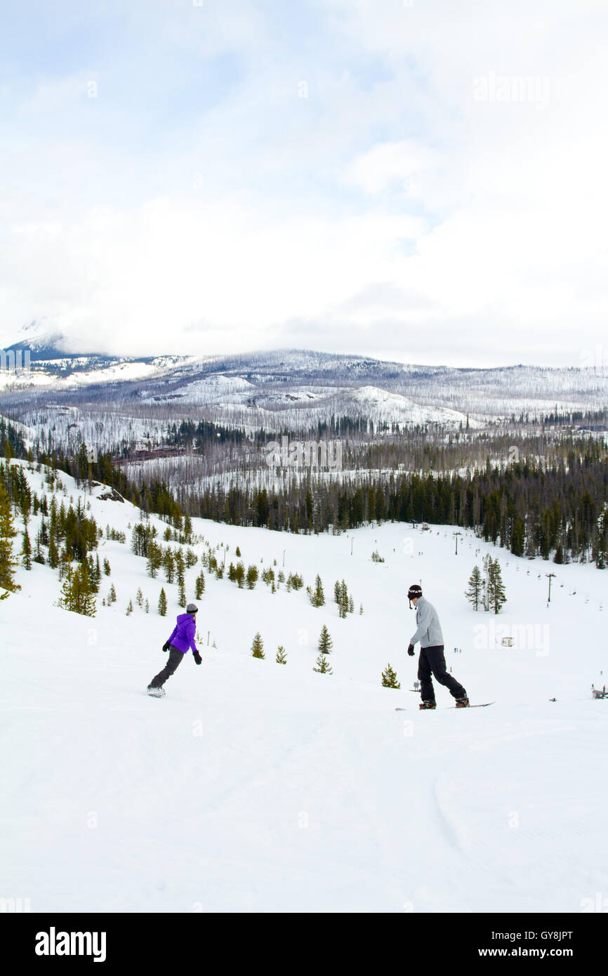 Two People Snowboarding Together Stock Photo - Alamy