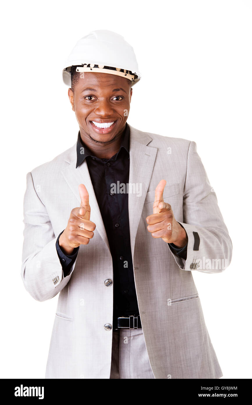 Male businessman wearing a helmet. Pointing Stock Photo - Alamy