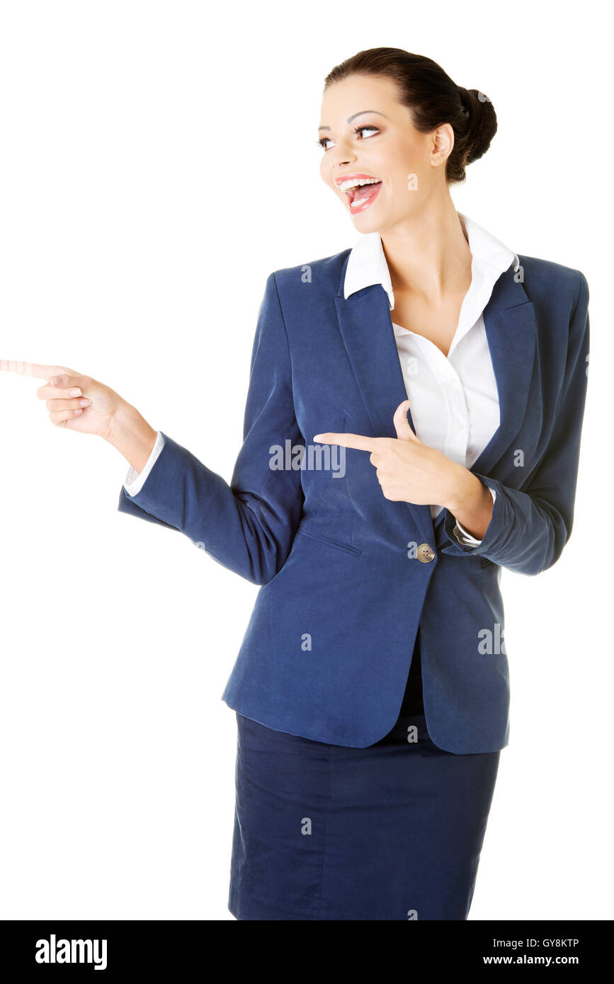 Attractive businesswoman pointing Stock Photo - Alamy