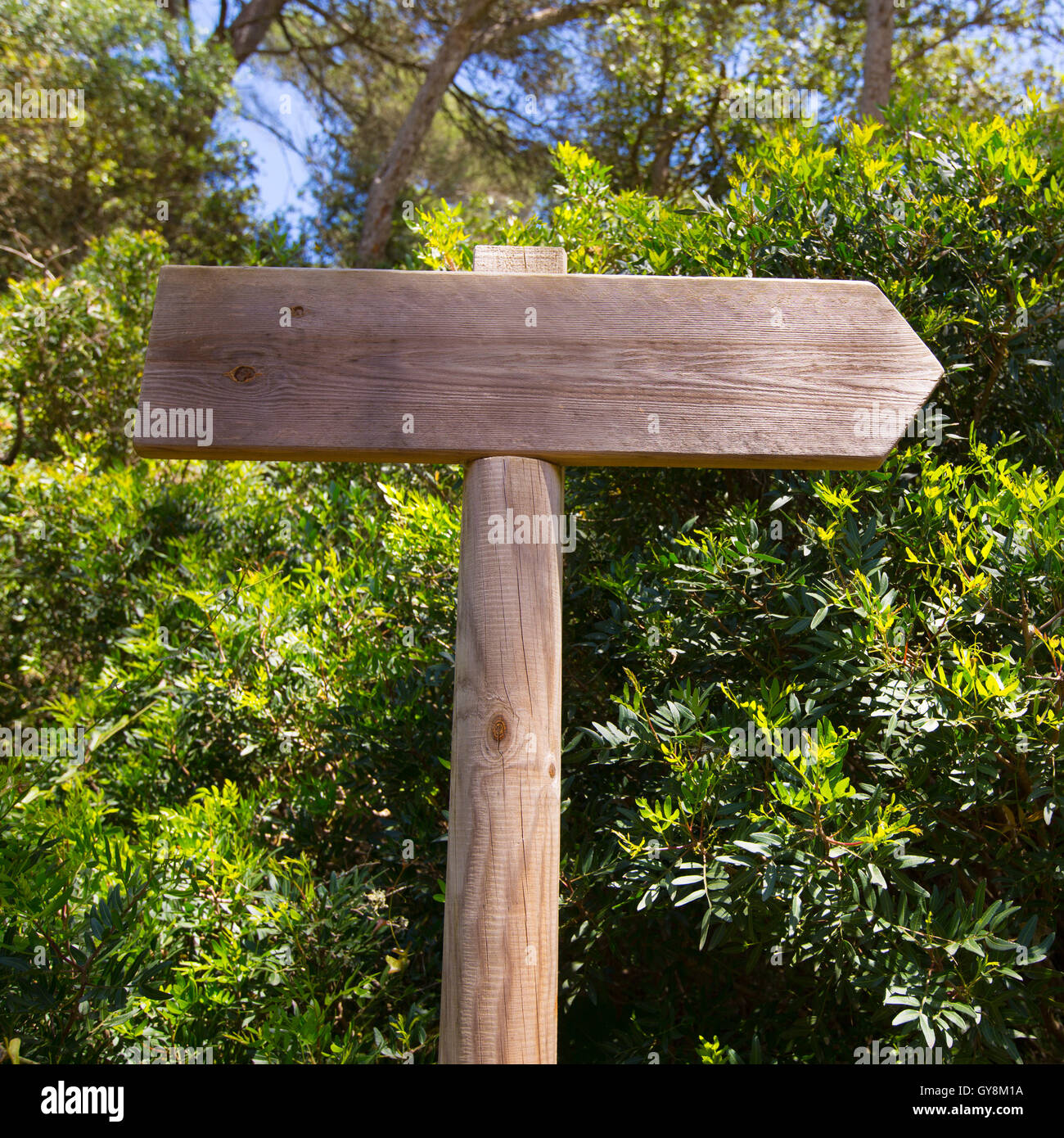 Wooden track road sign in Mediterranean Stock Photo - Alamy