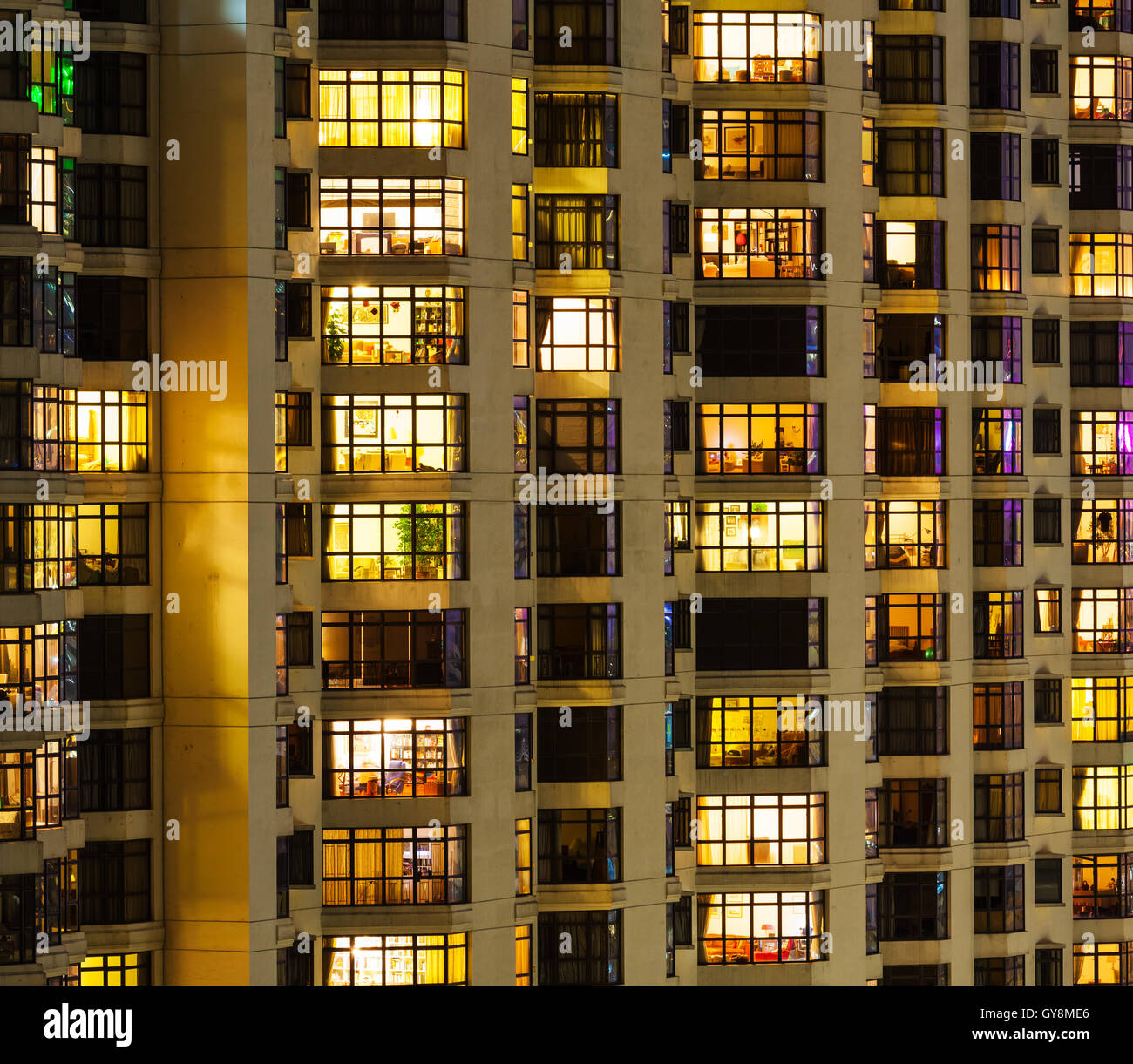 Extrior of apartment building at night Stock Photo - Alamy