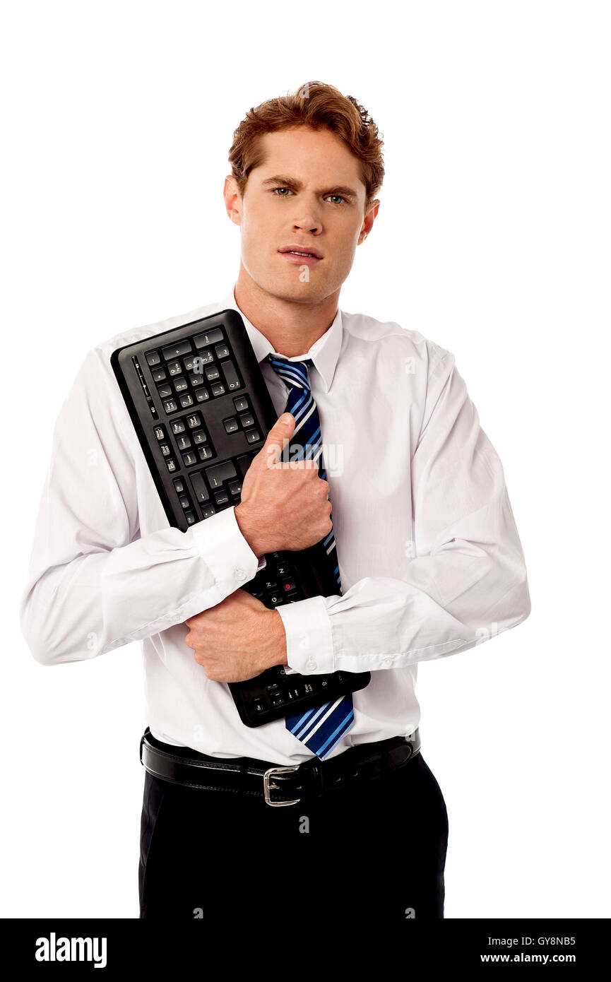Corporate man holding keyboard Stock Photo - Alamy