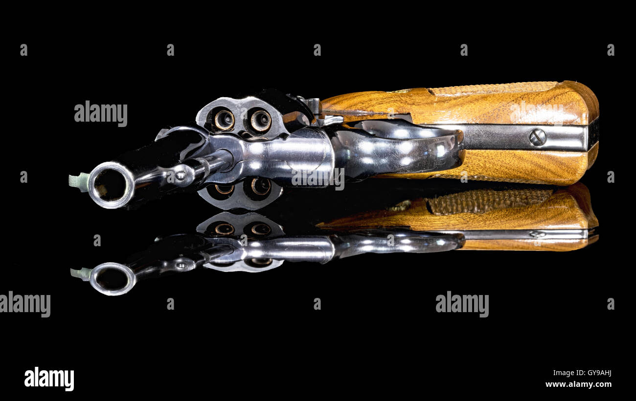 Bullets in a police issued gus with wood grips Stock Photo - Alamy