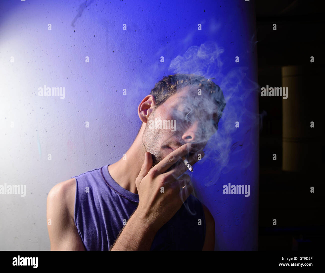 Youth smoking a cigarette hi-res stock photography and images - Alamy