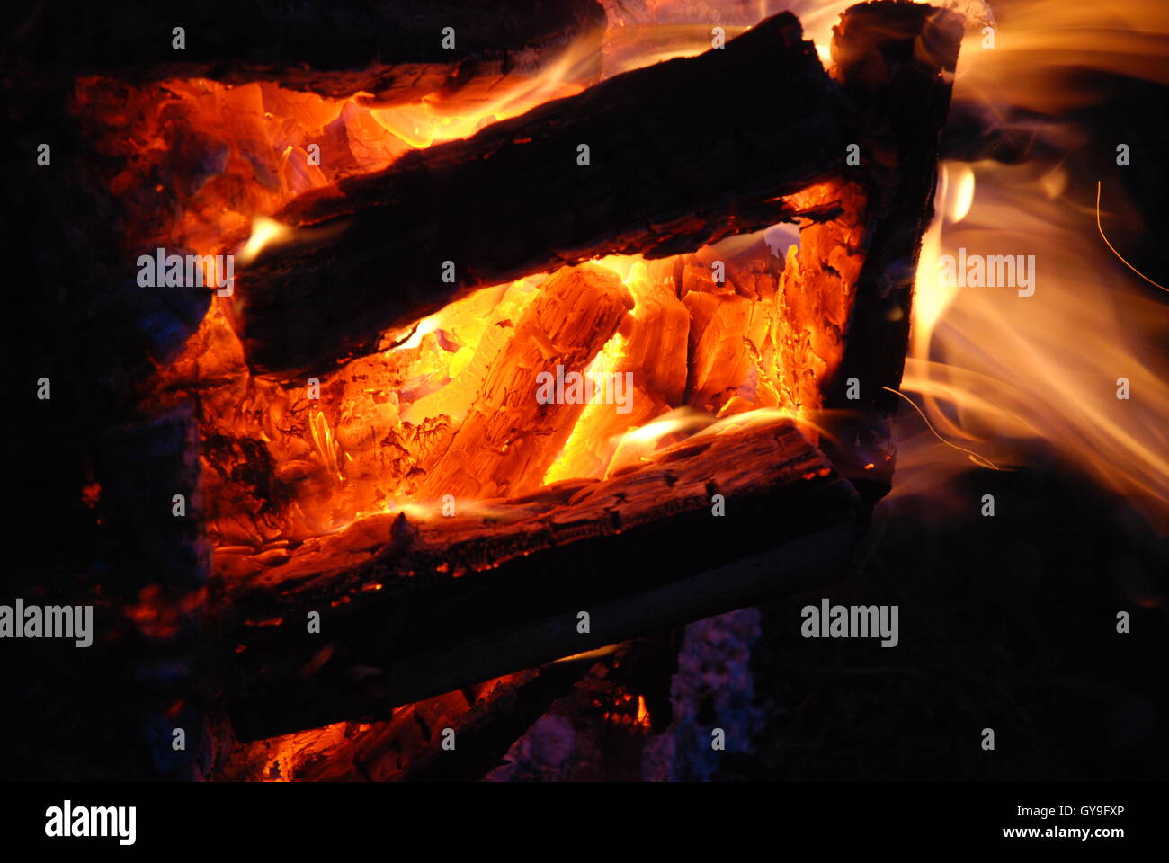 Capturing the Hot Coals glowing on a burning camp fire Stock Photo - Alamy