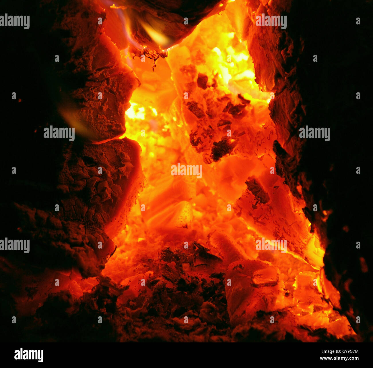 Capturing the Hot Coals glowing on a burning camp fire Stock Photo - Alamy