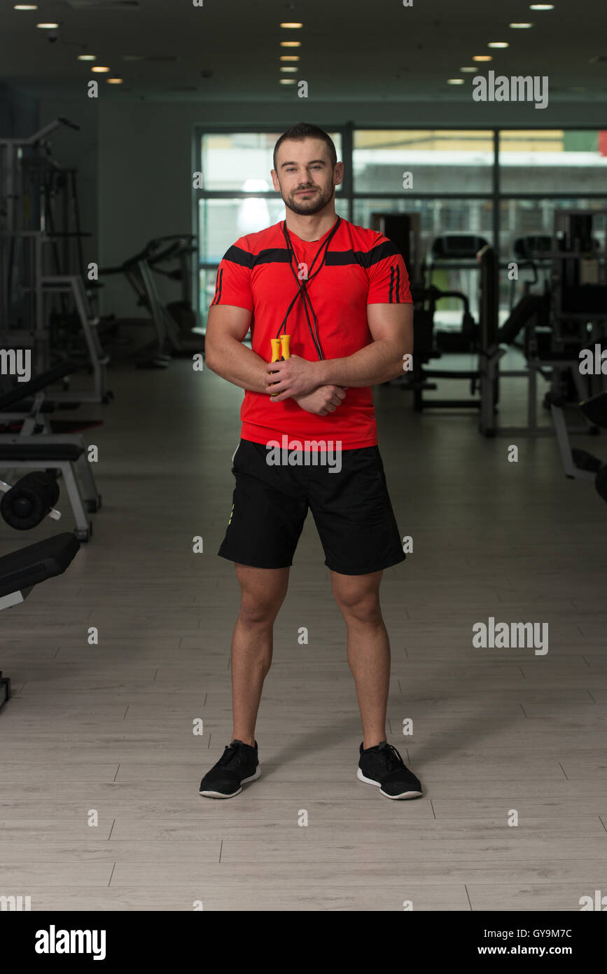 Portrait Of A Physically Fit Man Personal Trainer Posing With Jumping ...