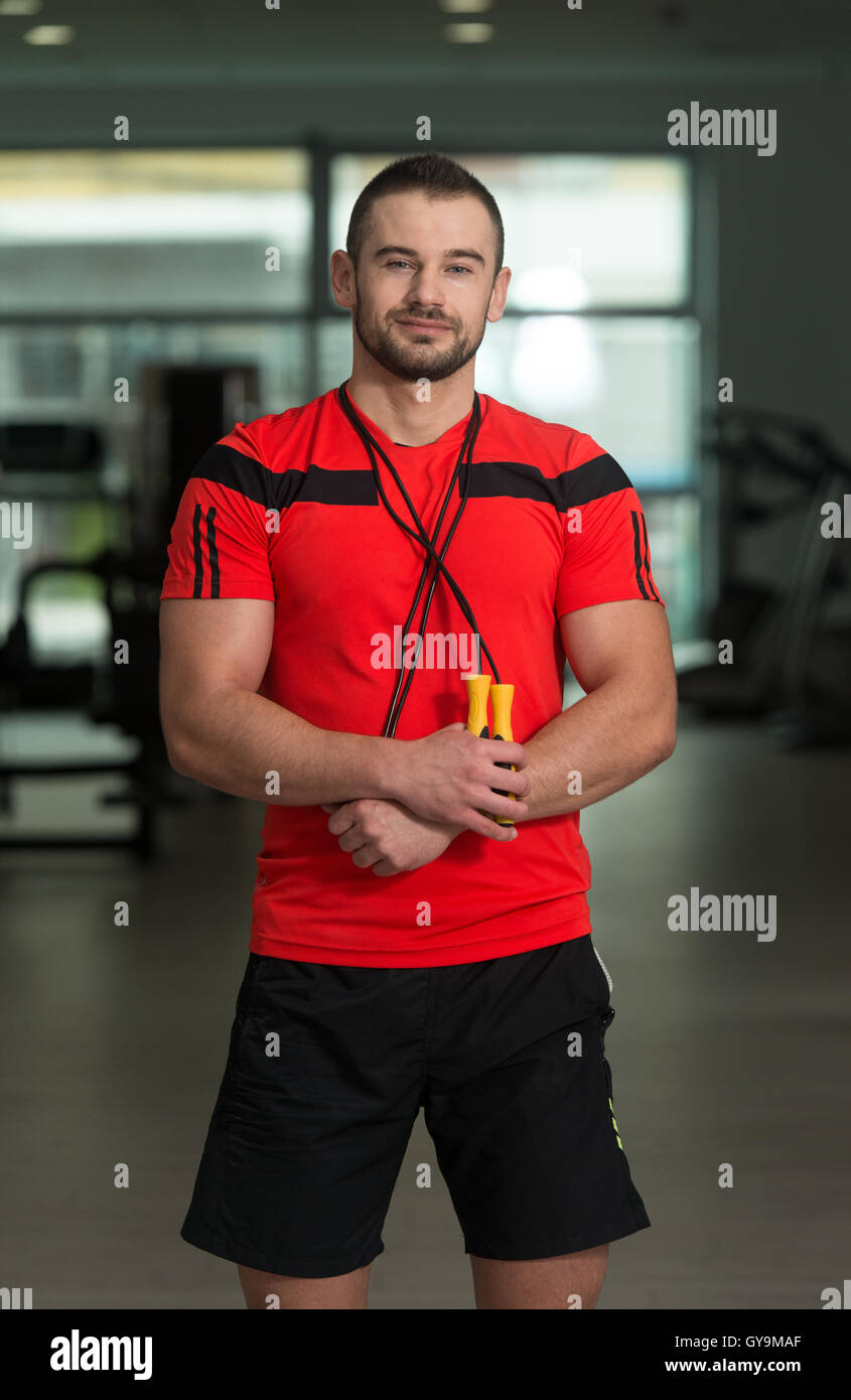 Portrait Of A Physically Fit Man Personal Trainer Posing With Jumping ...