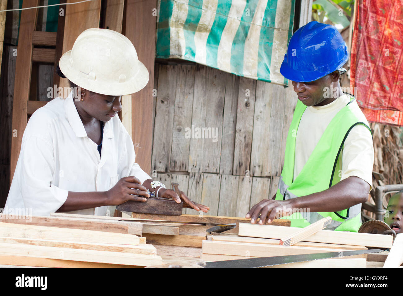 Young woman learning carpentry with her teacher in front of her Stock ...