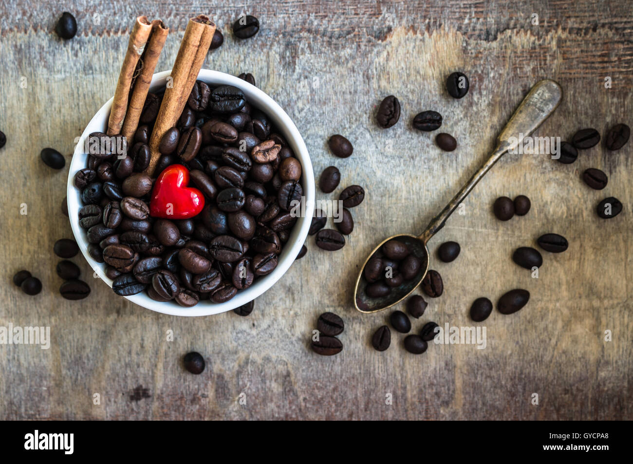 Coffee beans on rustic background Stock Photo - Alamy