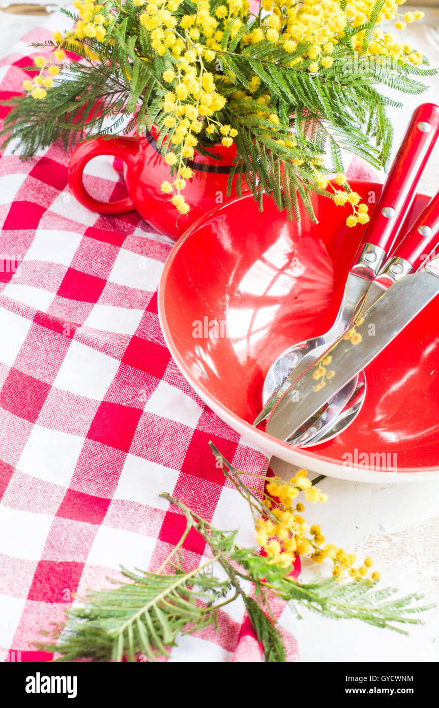 Spring festive dining table setting with yellow mimosa flowers Stock ...