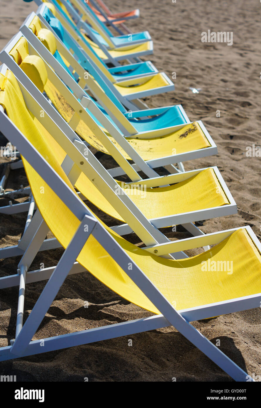 Bright colors sun chairs on the sand beach of Mediterranean sea Stock ...