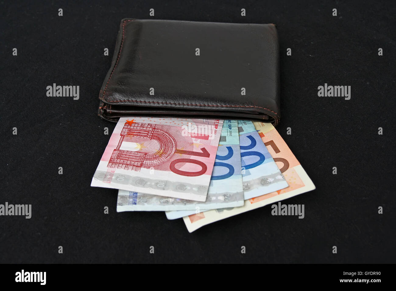 Brown leather wallet. Wallet with Euro paper bank notes Stock Photo - Alamy