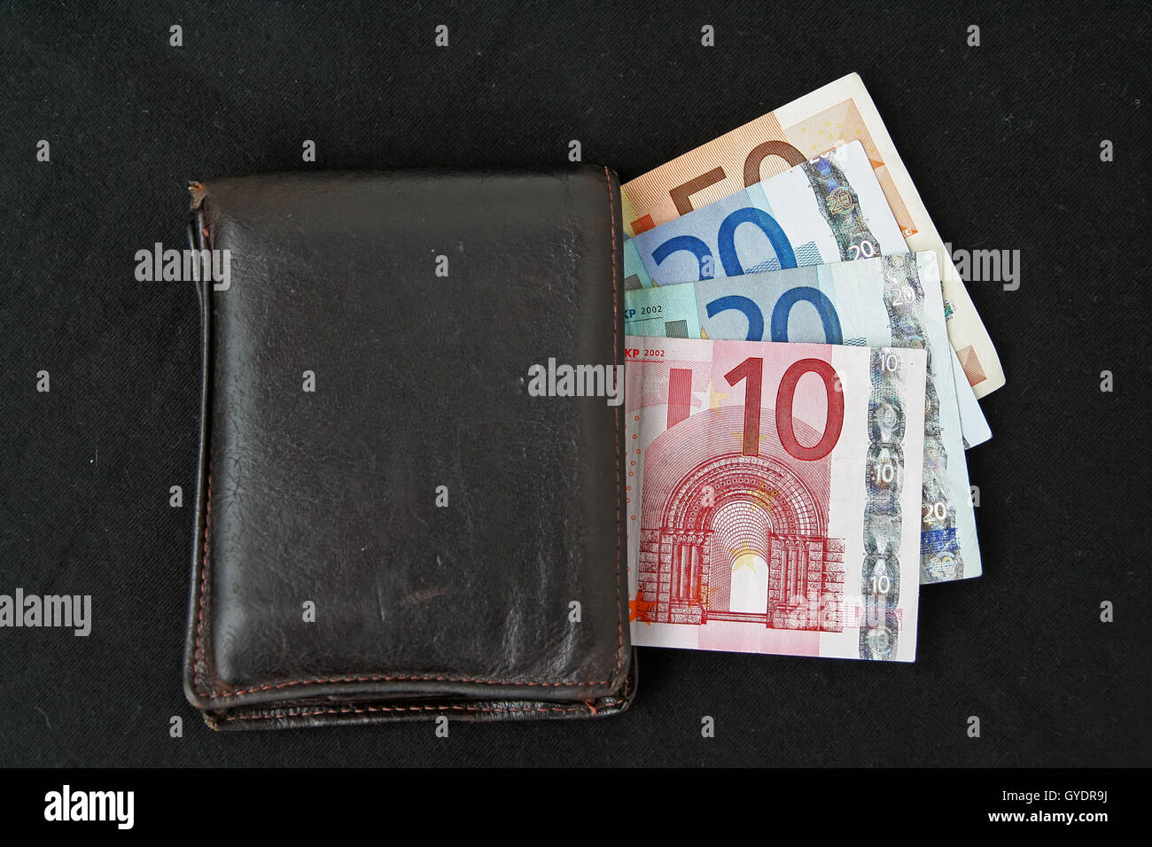 Brown leather wallet. Wallet with Euro paper bank notes Stock Photo - Alamy