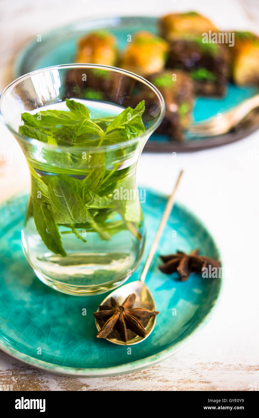 Traditional turkish dessert - mint tea and bakhlava on rustic ...