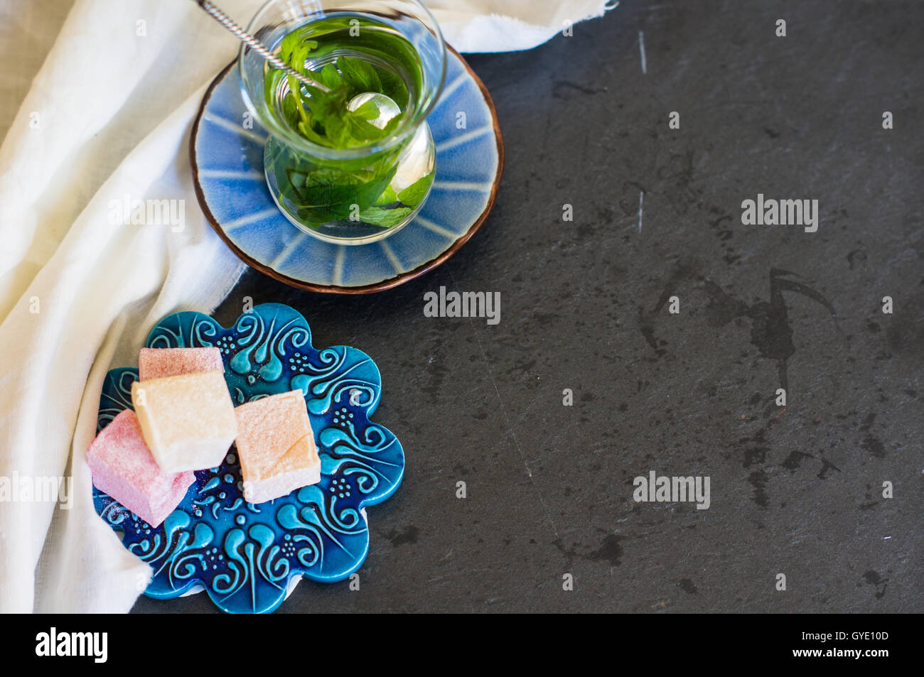 Traditional turkish dessert - mint tea and bakhlava on rustic ...