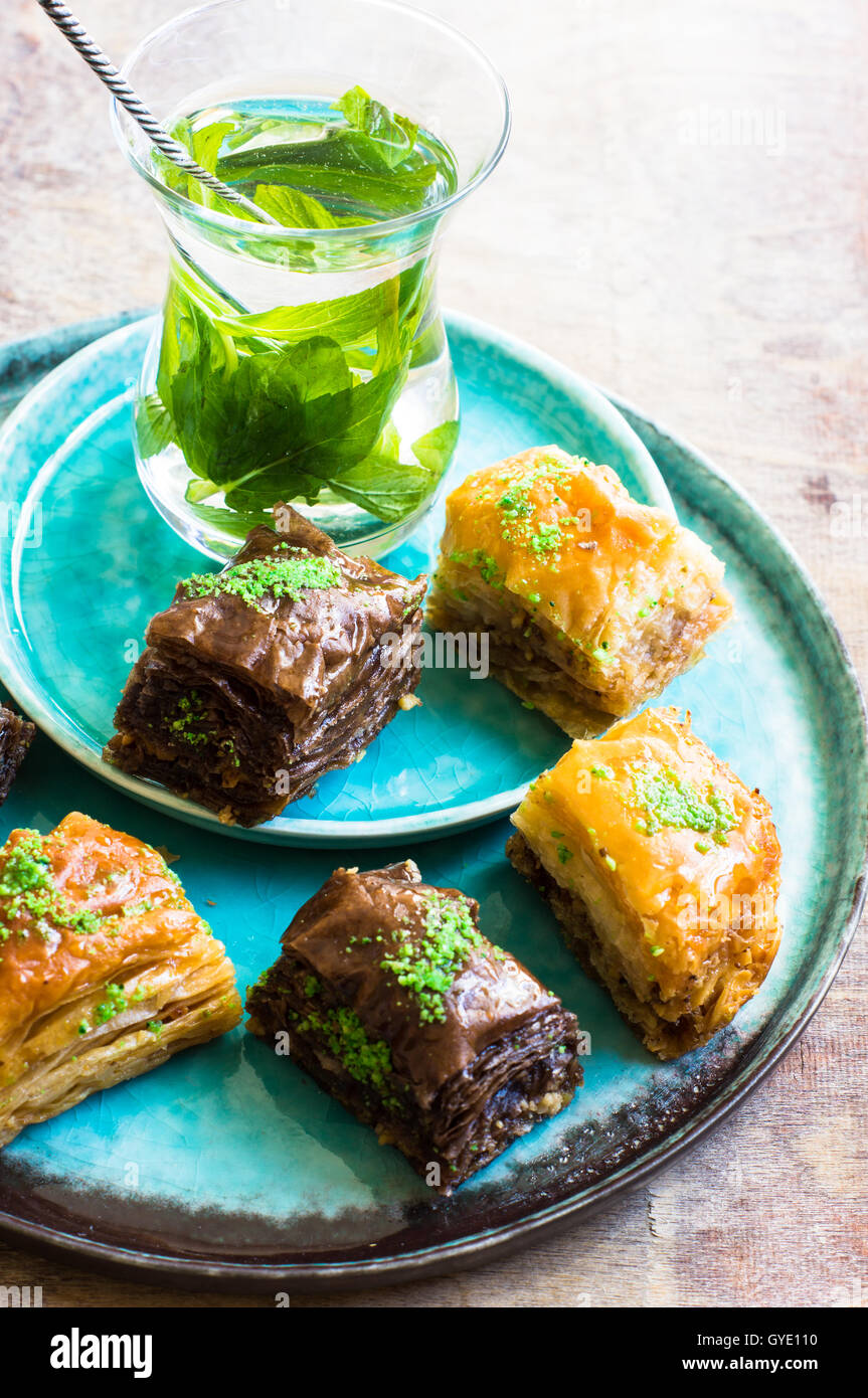 Traditional turkish dessert - mint tea and bakhlava on rustic ...