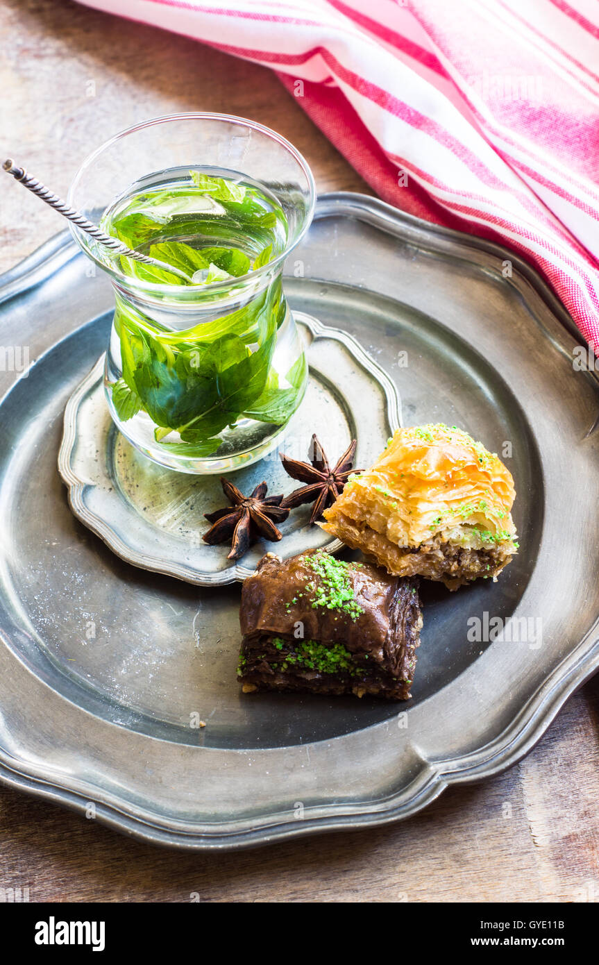 Traditional turkish dessert - mint tea and bakhlava on rustic ...
