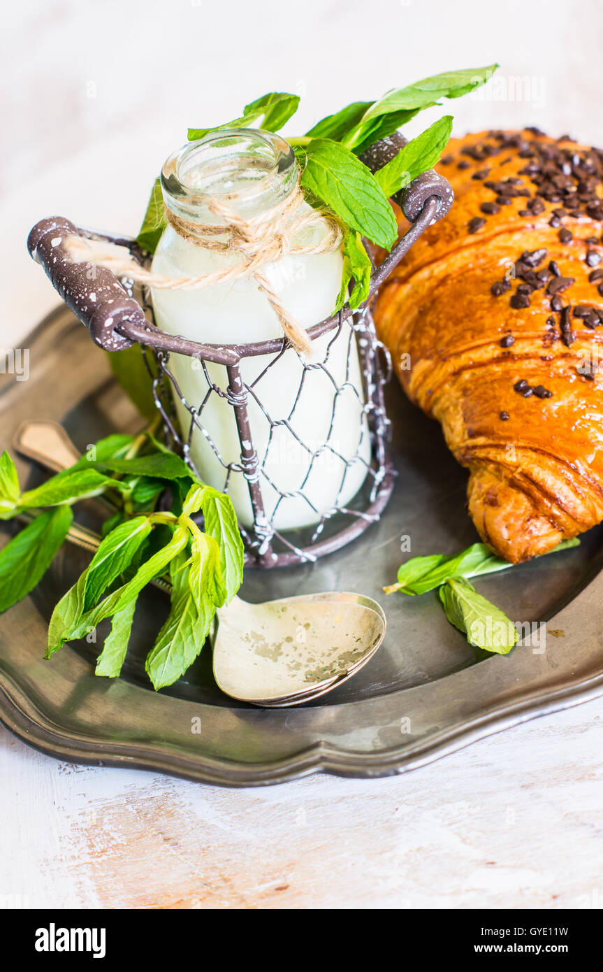 Mint milk and croissant with chocolate as a breakfast background Stock ...