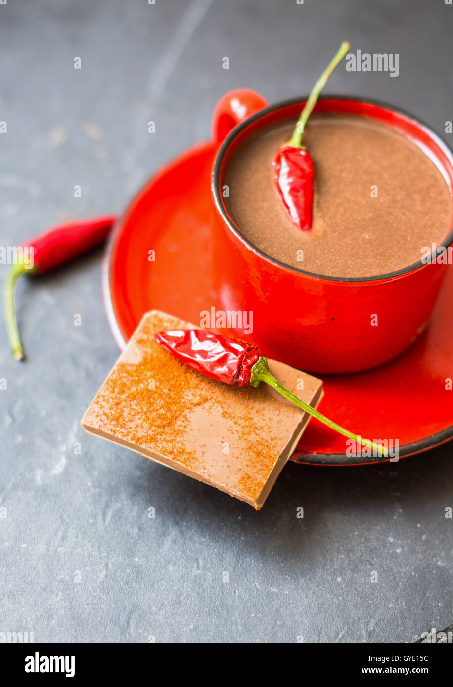 Red cup of hot chocolate with red pepper, selective focus Stock Photo ...