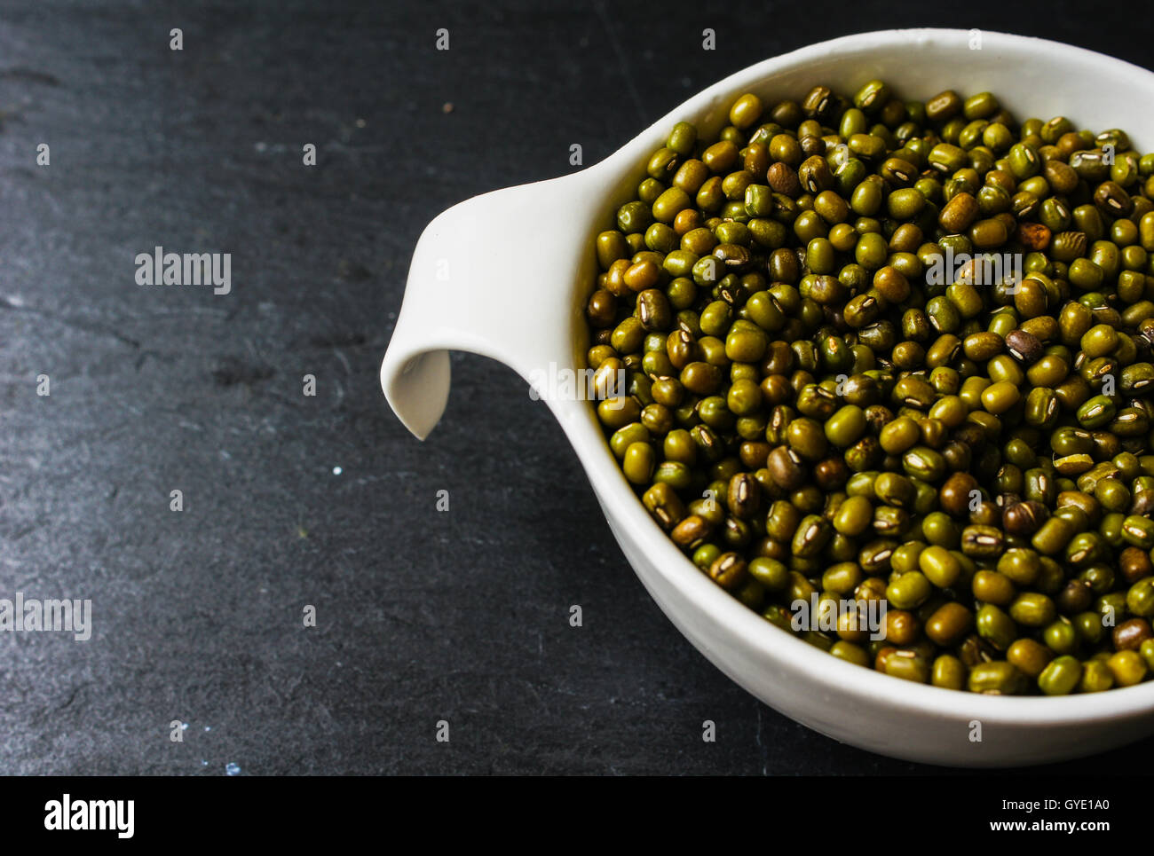 Green bean or mung bean on the black stone background Stock Photo - Alamy