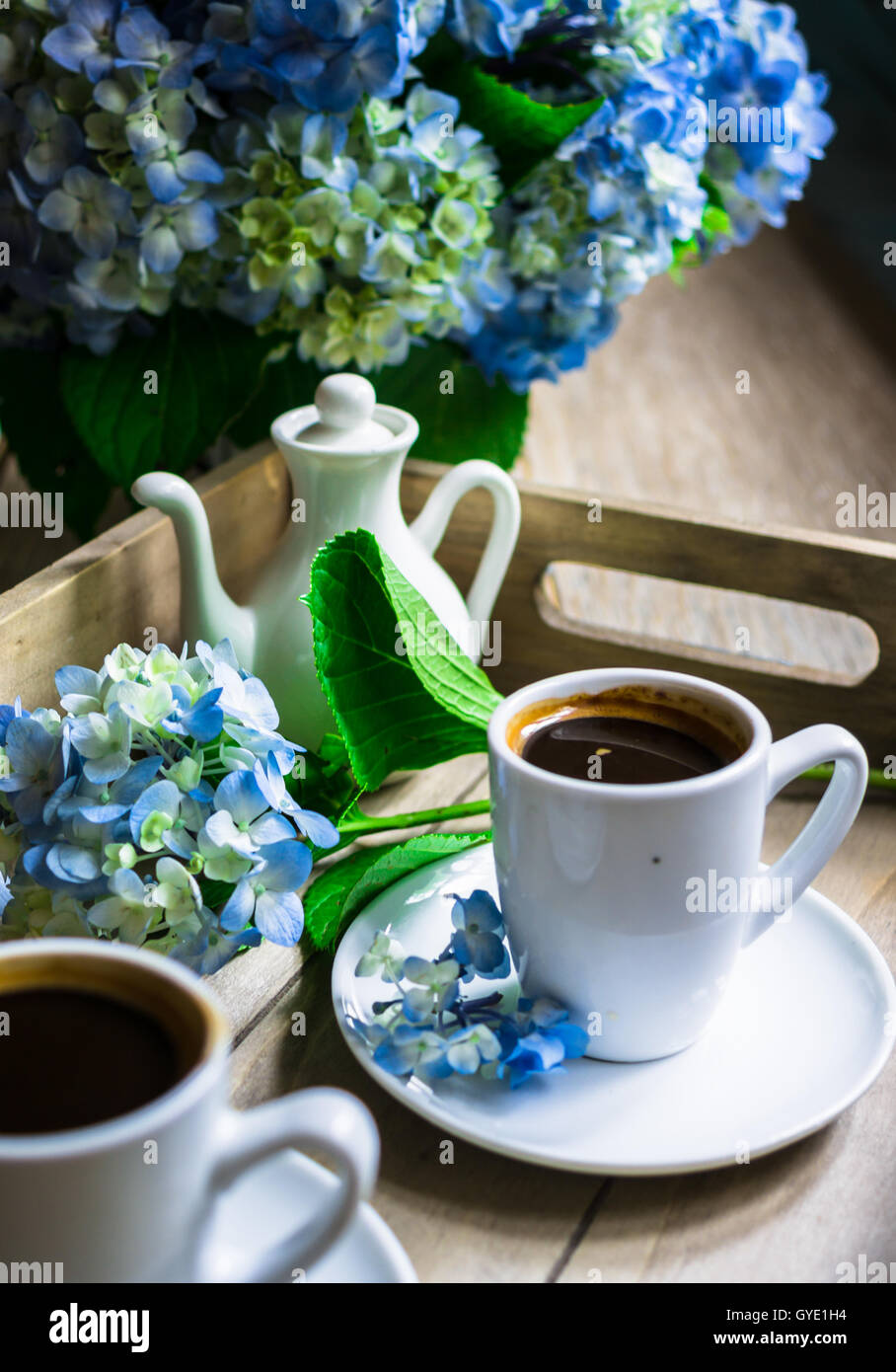 Blue pastel color hydrangea flowers and good morning note on wooden ...