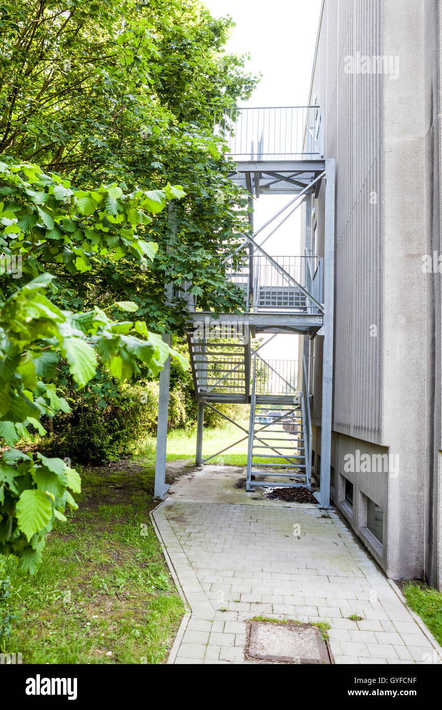 an tall building there is an emergency staircase Stock Photo - Alamy