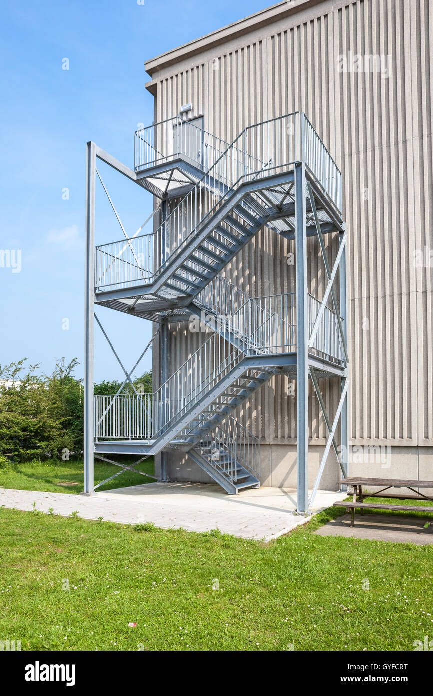 an tall building there is an emergency staircase Stock Photo - Alamy