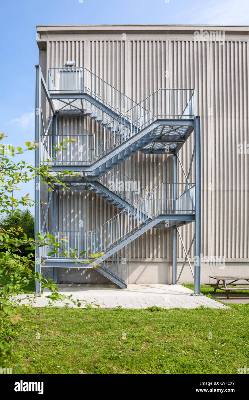 an tall building there is an emergency staircase Stock Photo - Alamy