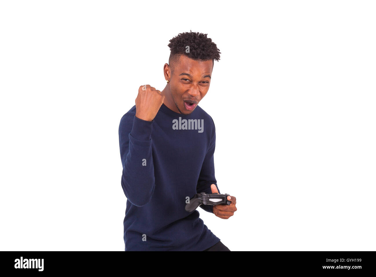 Happy young african american man playing video games celebrating ...