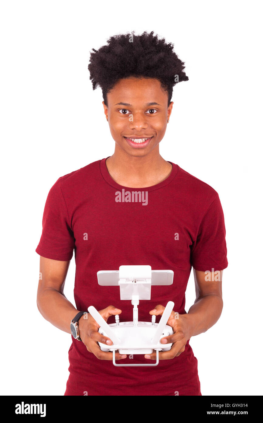 African American young man holding a drone remote control over white ...