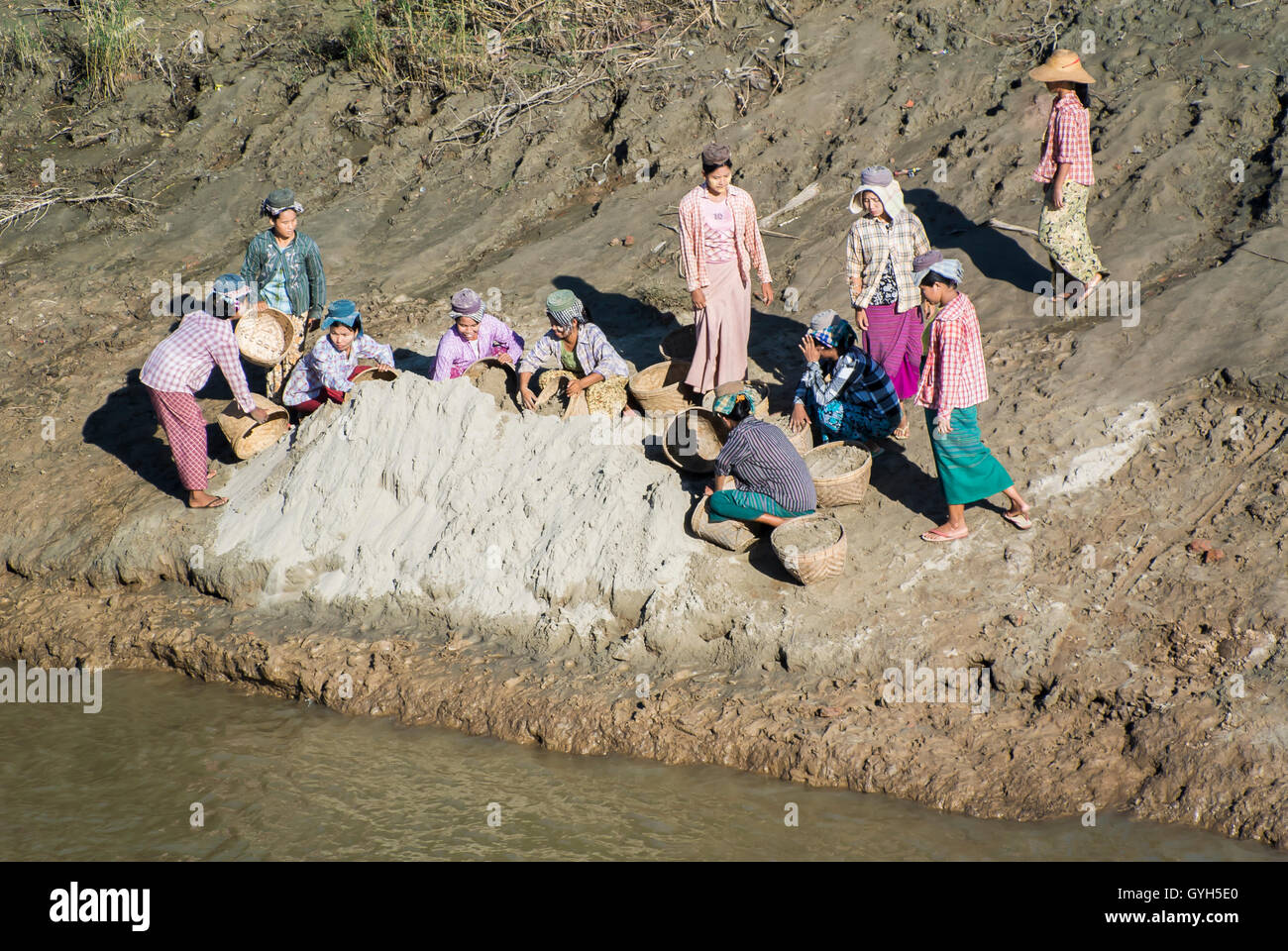 Village Women at Shoreline Collecting Clay to Make Pottery, Myanmar ...