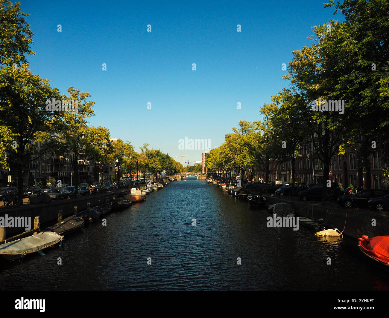 Water canal with boats in Amsterdam, Netherlands Stock Photo - Alamy