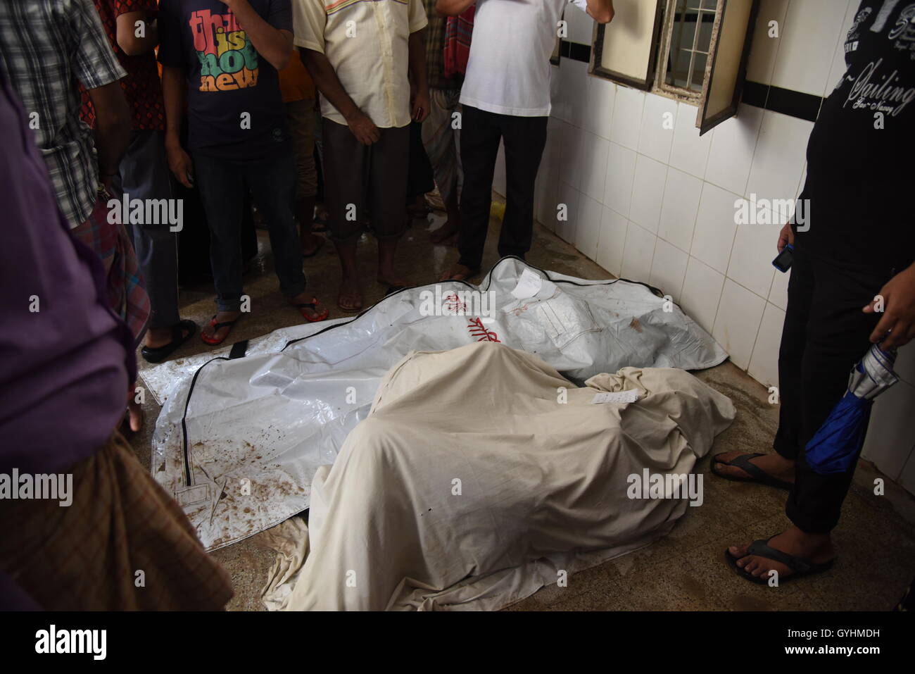 Bodies of a fire victims are placed at a makeshift morgue in a hospital ...